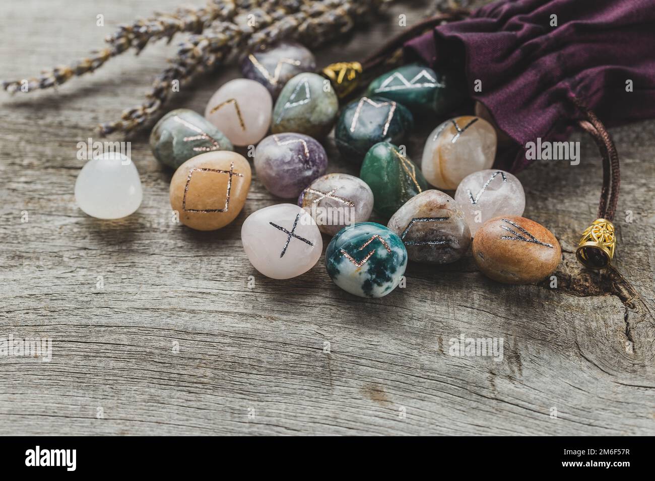 Elder Futhark Rune Stones Set Made of Natural Gemstones on Wooden ...