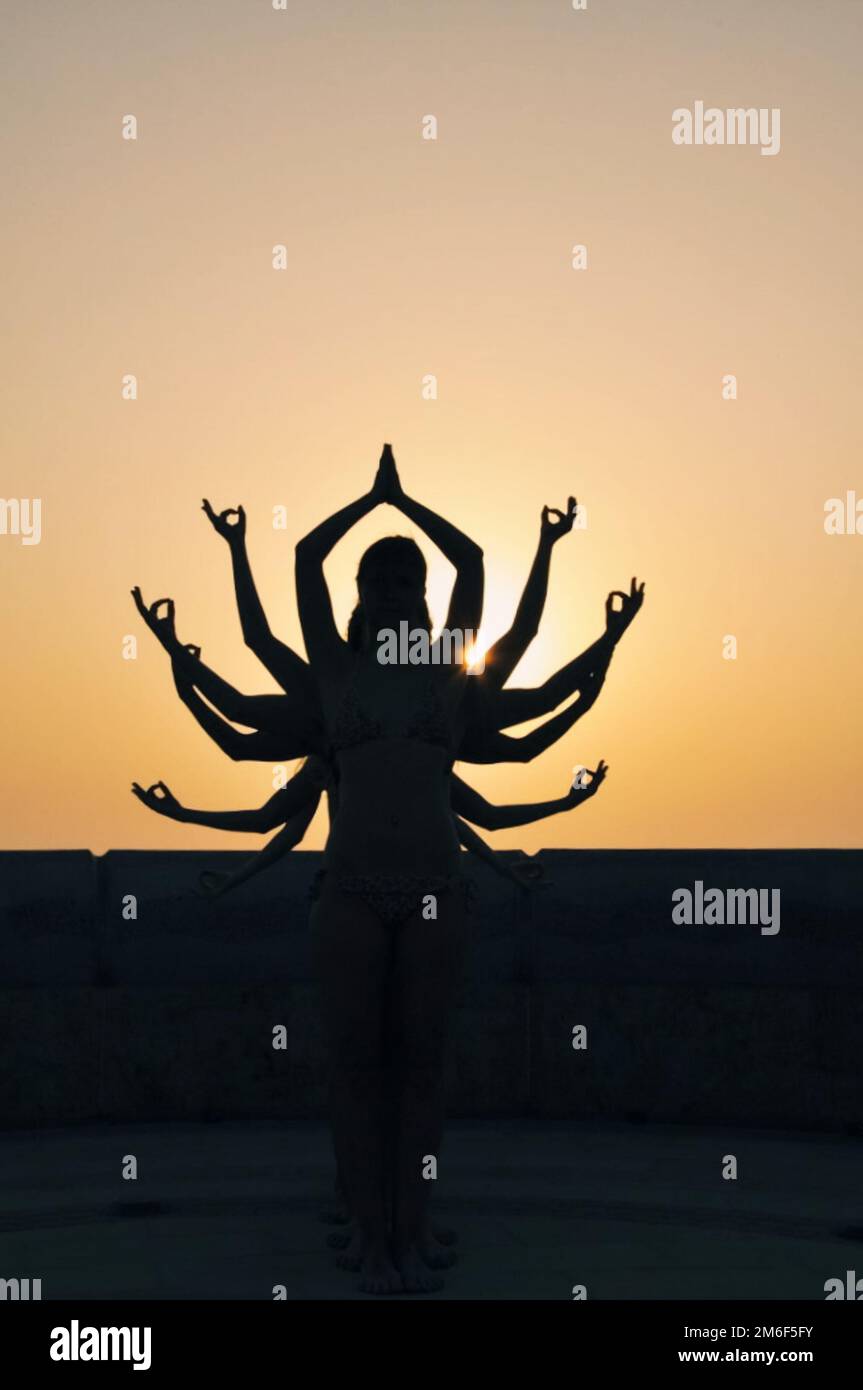 Shiva is a multi-armed deity. Figures of girls who were in form of ...