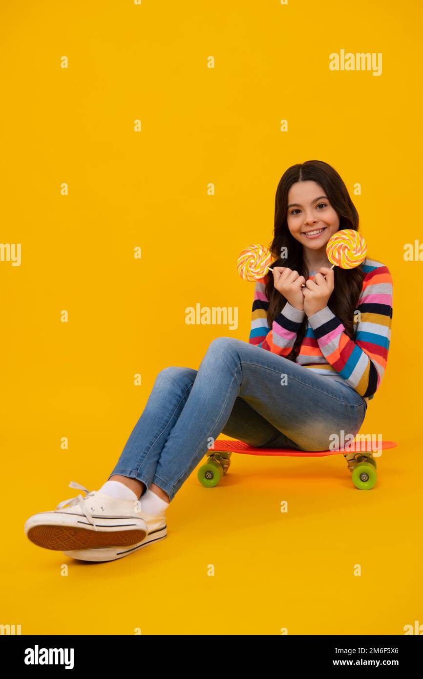 Teenage girl with candy lollipop, happy child 12, 13, 14 years old ...