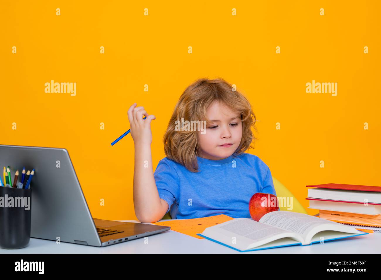 Child writing lesson. School kid 7-8 years old with book go back to ...