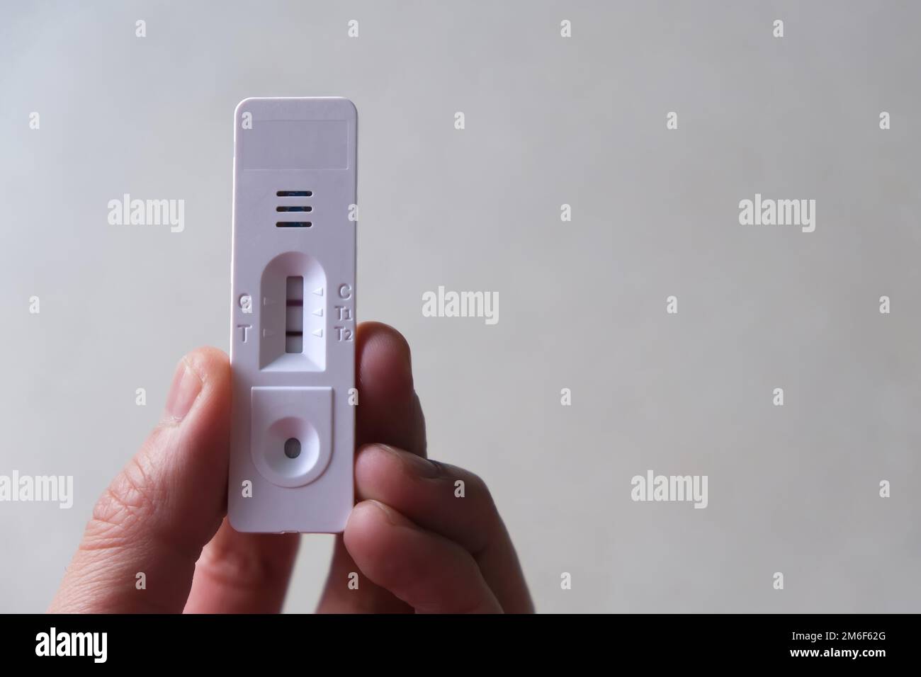close up hand showing Rapid Antigen Test COVID-19 positive result Stock ...