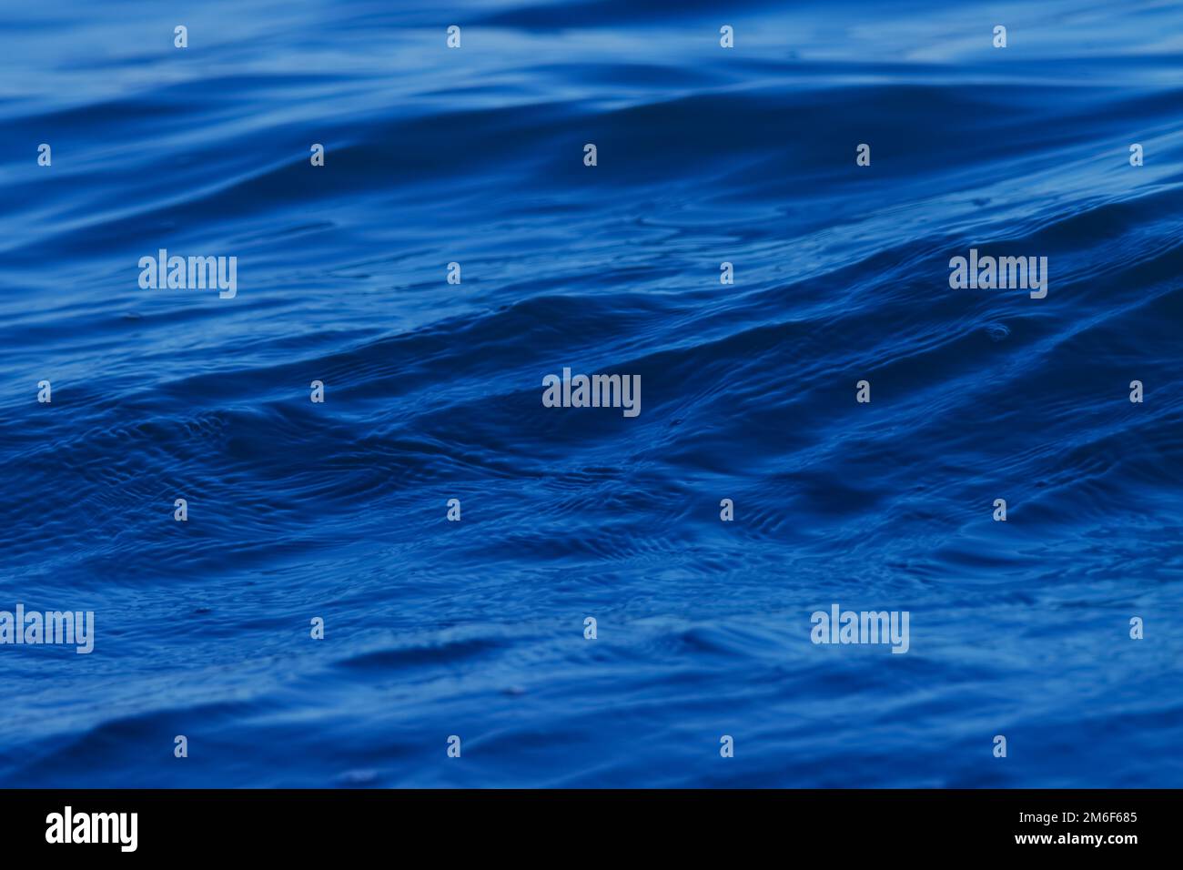 Blue ocean water background Stock Photo - Alamy