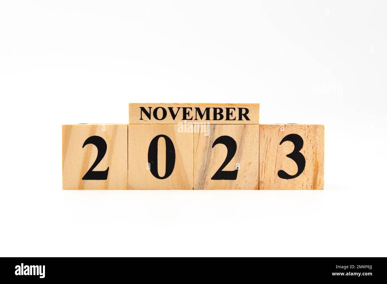 November 2023 written on wooden blocks isolated on white background ...