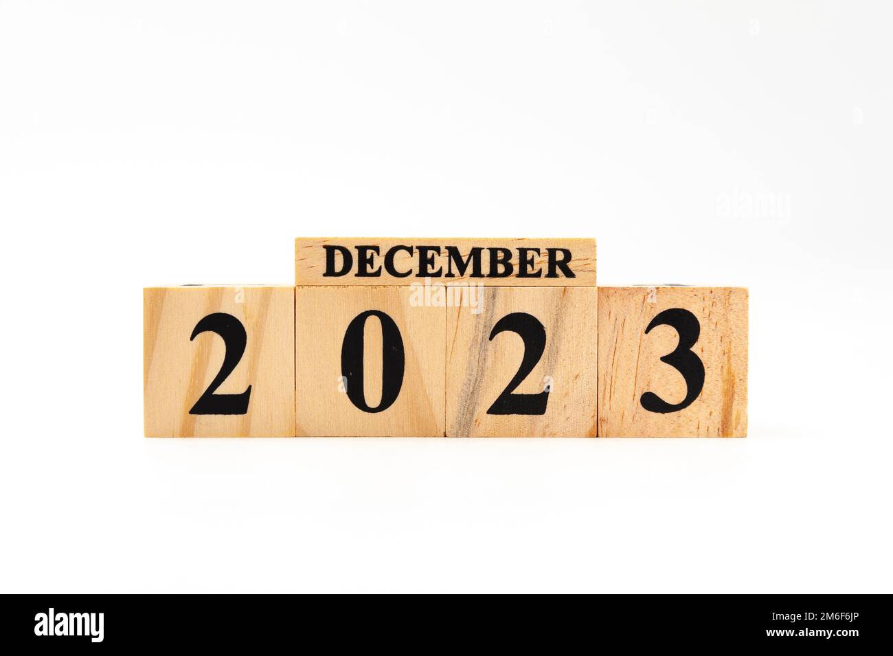 December 2023 written on wooden blocks isolated on white background ...