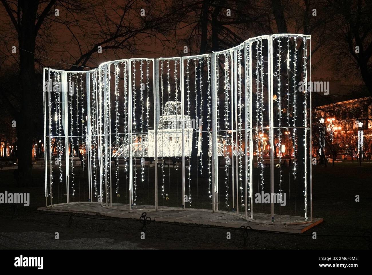 Winter snowy morning and New Year's electrical decorations in the city ...