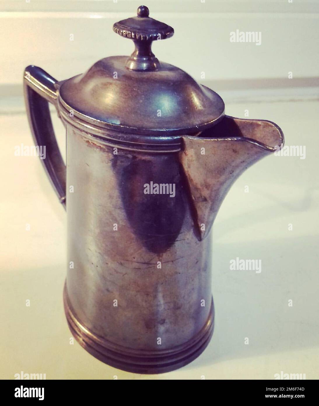 Steel jug with a handle and lid Stock Photo - Alamy
