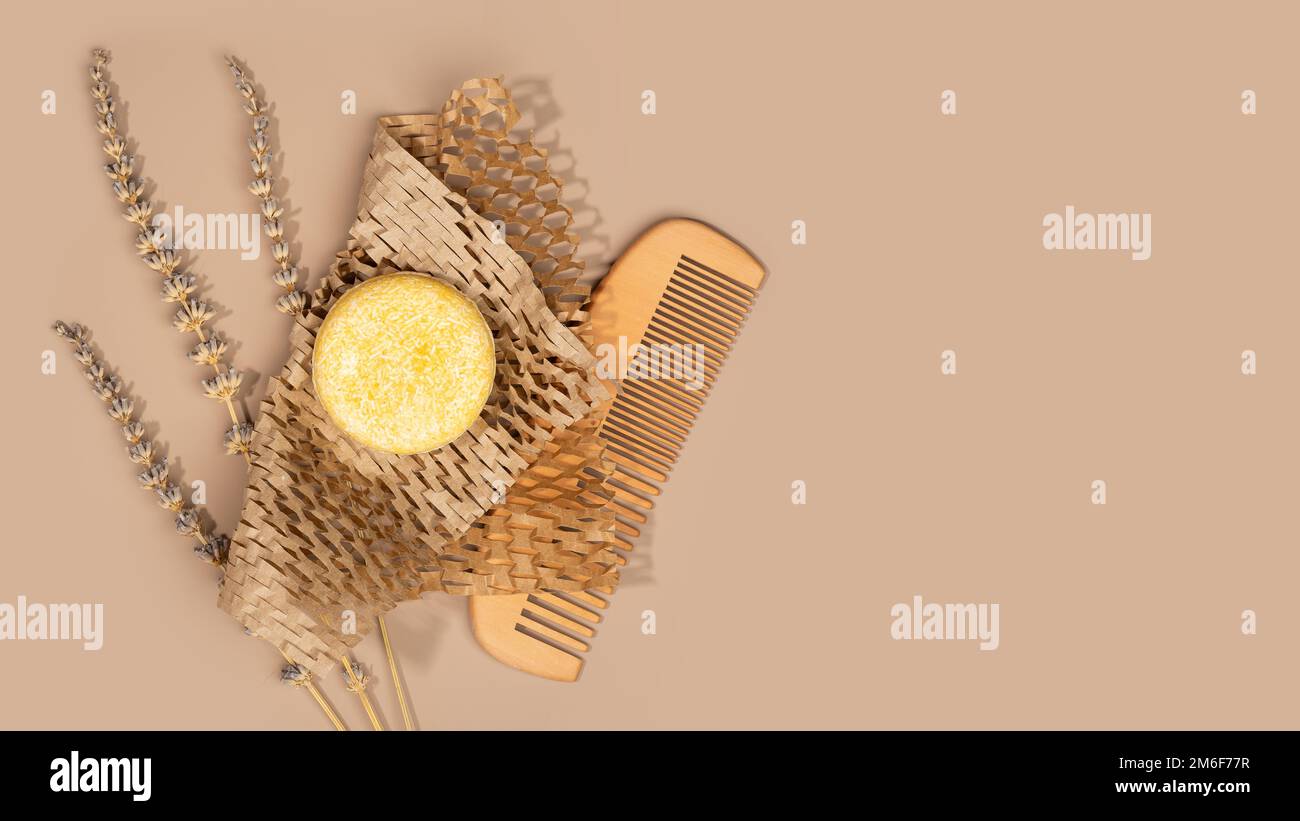 Sustainable solid shampoo bar and wooden comb laying on a Honeycomb ...