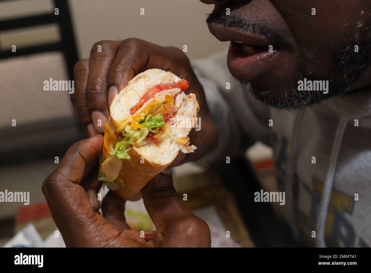 Man holding a sandwich hi-res stock photography and images - Alamy