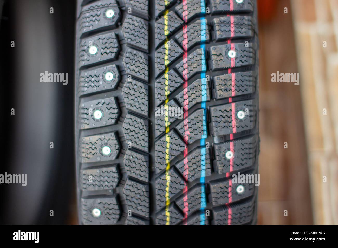 New, black winter car tires with spikes Stock Photo - Alamy