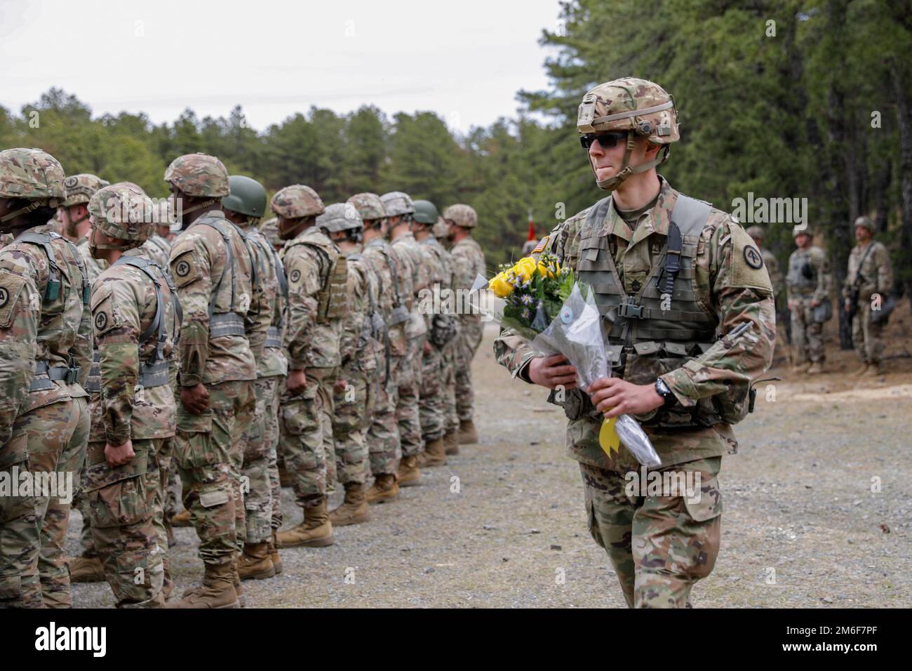 U.S. Army Sgt. Steven Arose brings flowers to 1st Sgt. Benjamin Lore’s ...