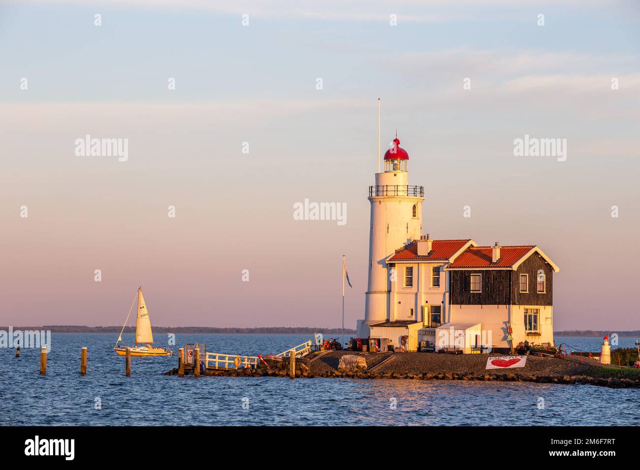 paard van marken lighthouse on marken island in golden hour with blue ...