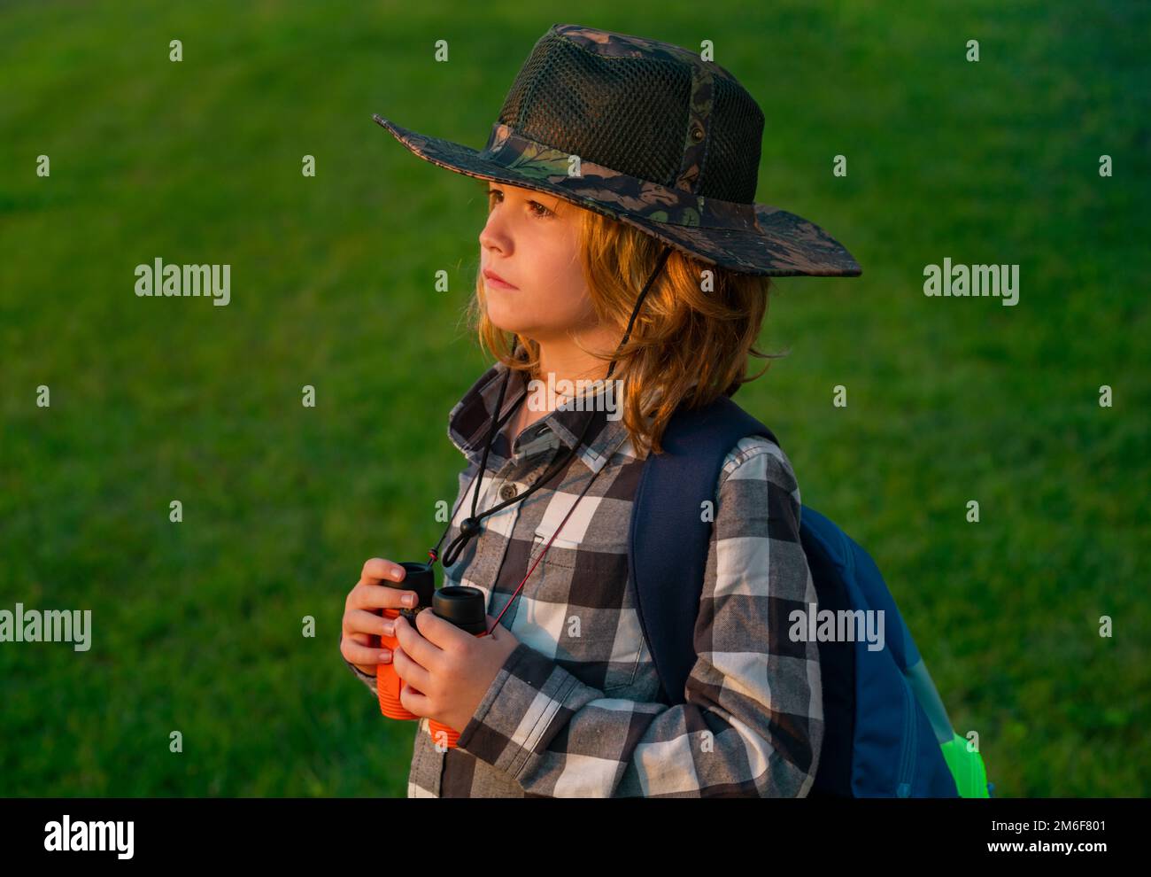 Scout boy wearing explorer hat and backpack outdoor. Explorer and ...
