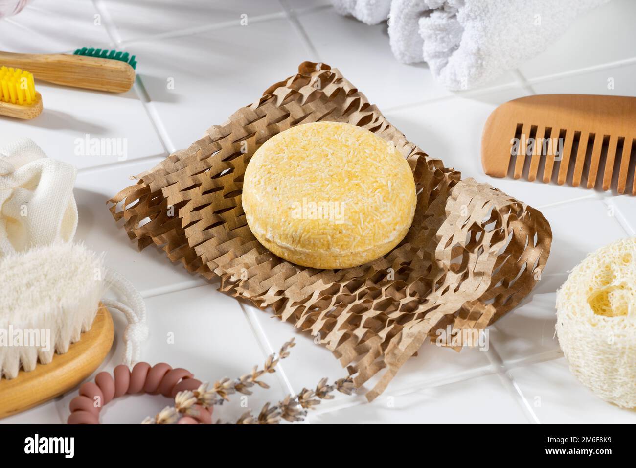 Eco friendly solid shampoo bar and natural bathroom accessories lying ...