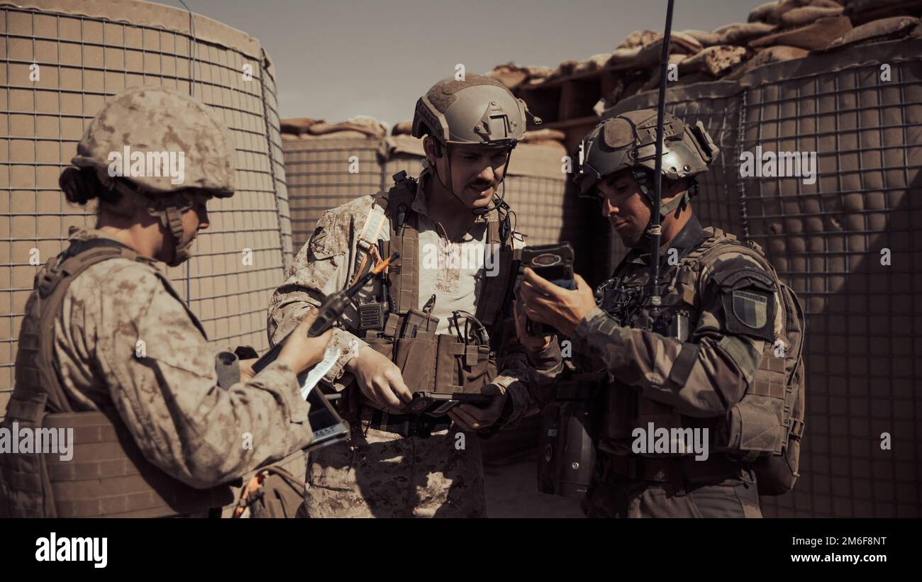 U.S. Marines with Tactical Training and Exercise Control Group, and a French Foreign Legionnaire ...