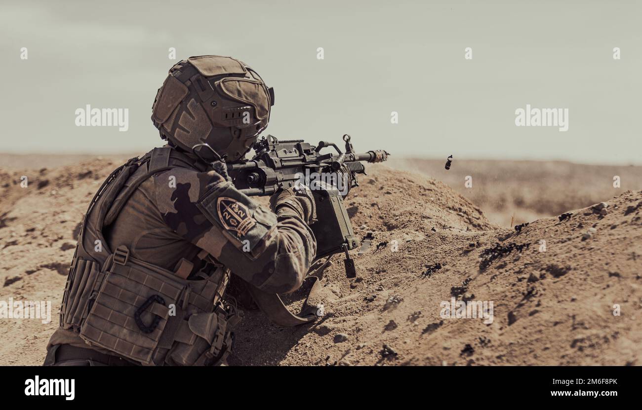A French Foreign Legionnaire fires his FN Herstal MAG 58 machine gun ...
