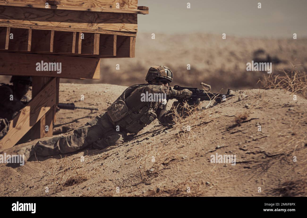 A French Foreign Legionnaire reloads his FN Herstal MAG 58 machine gun ...