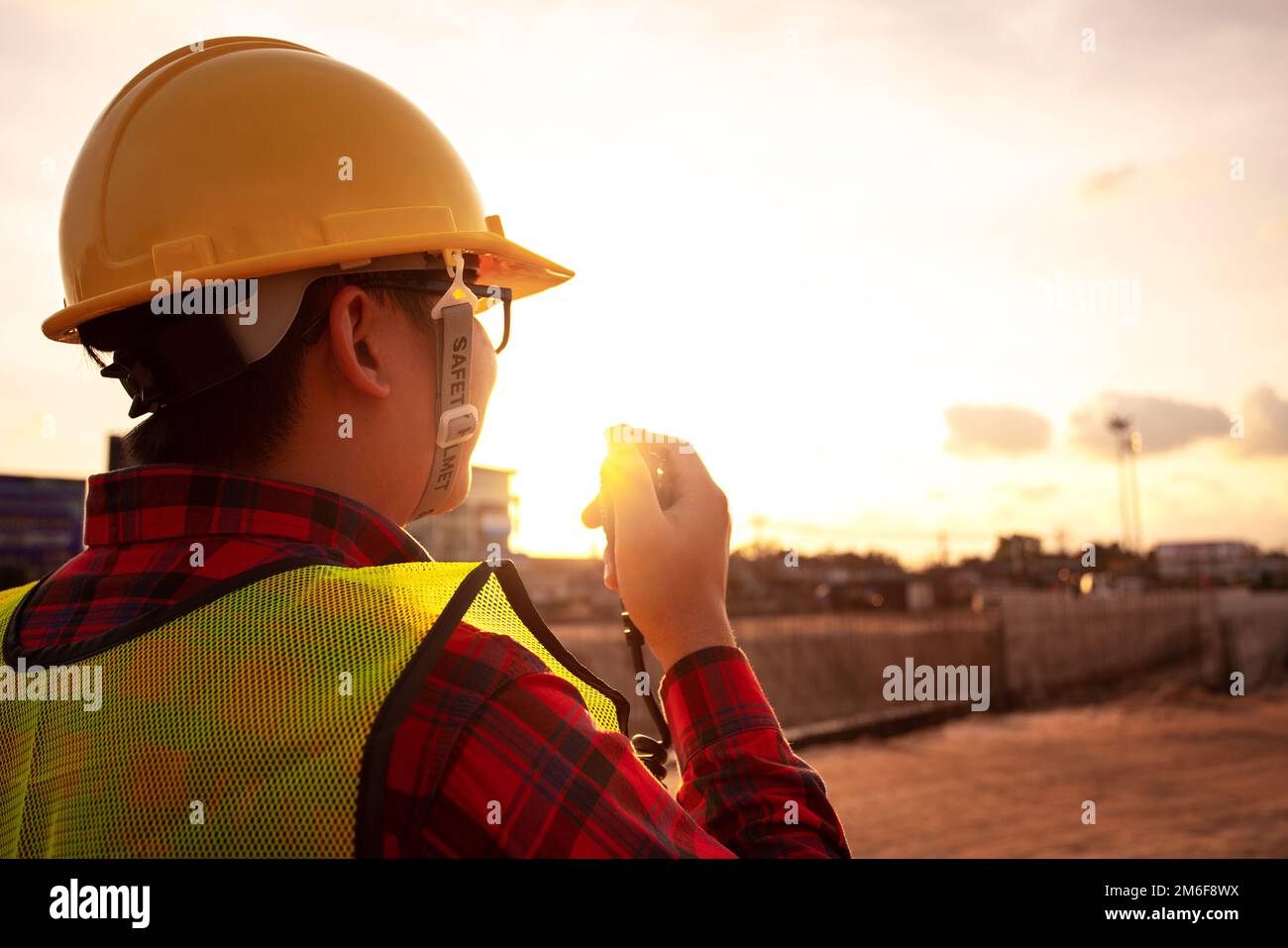 asian technician civil engineer talk with team by walkie talkie and ...