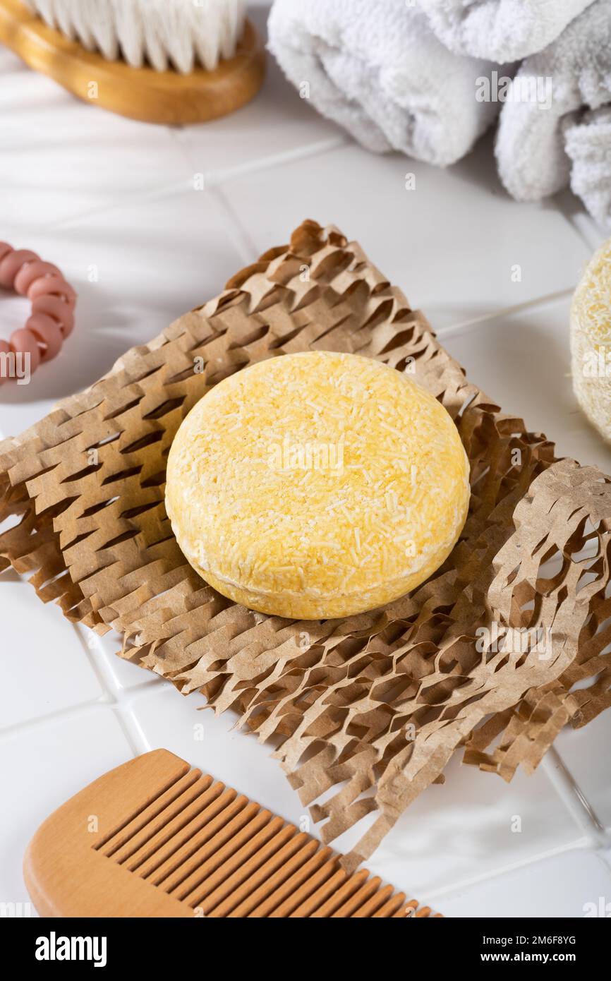 Eco friendly solid shampoo bar and natural bathroom accessories lying ...