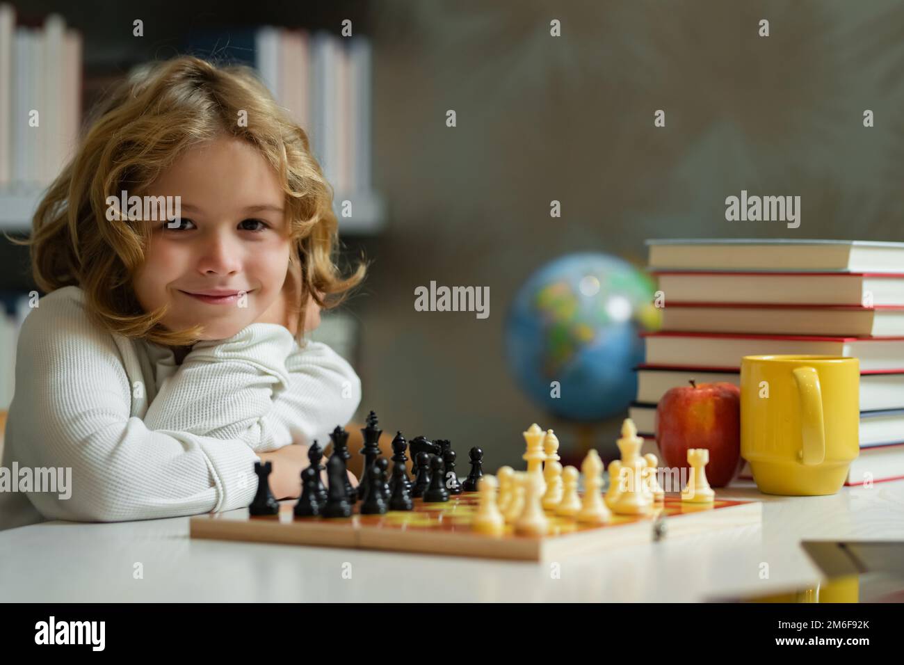 Chess game for children. Shool kid playing chess in classroom. Brain ...