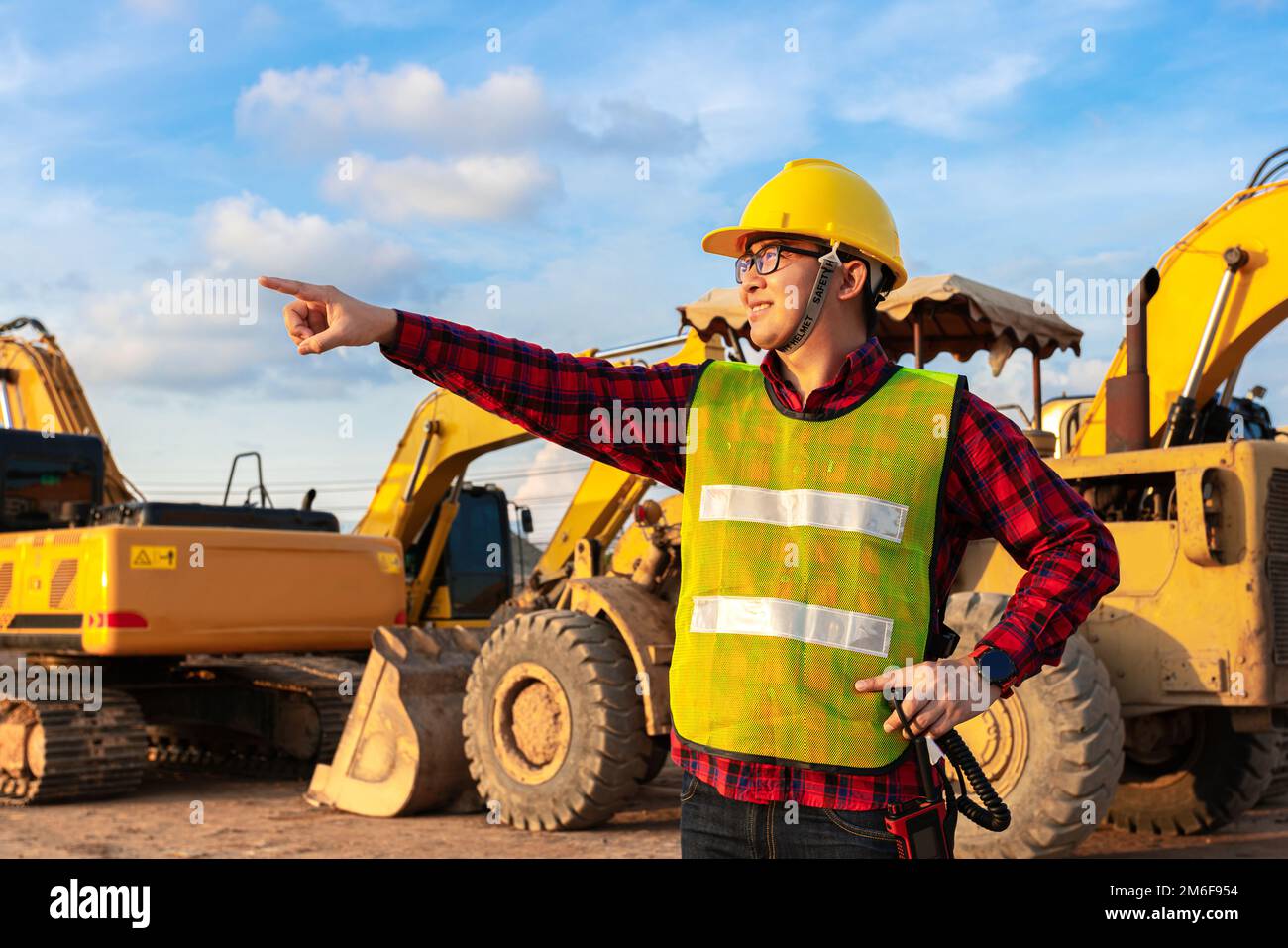 asian technician civil engineer talk with team by walkie talkie and ...