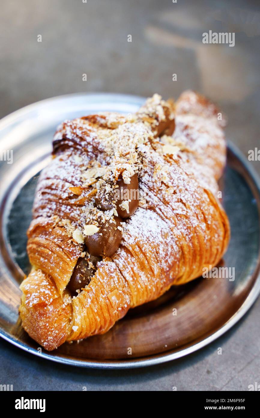 French croissant for breakfast in a cafe. Fresh, delicious, sweet ...