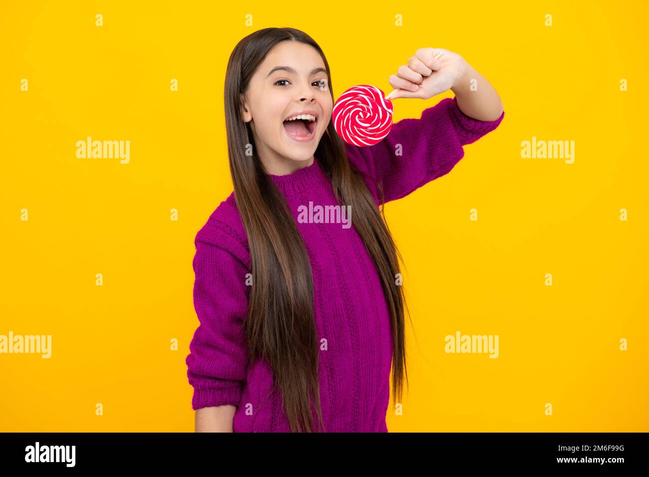 Excited face. Teenage girl with candy lollipop, happy child 12, 13, 14 ...