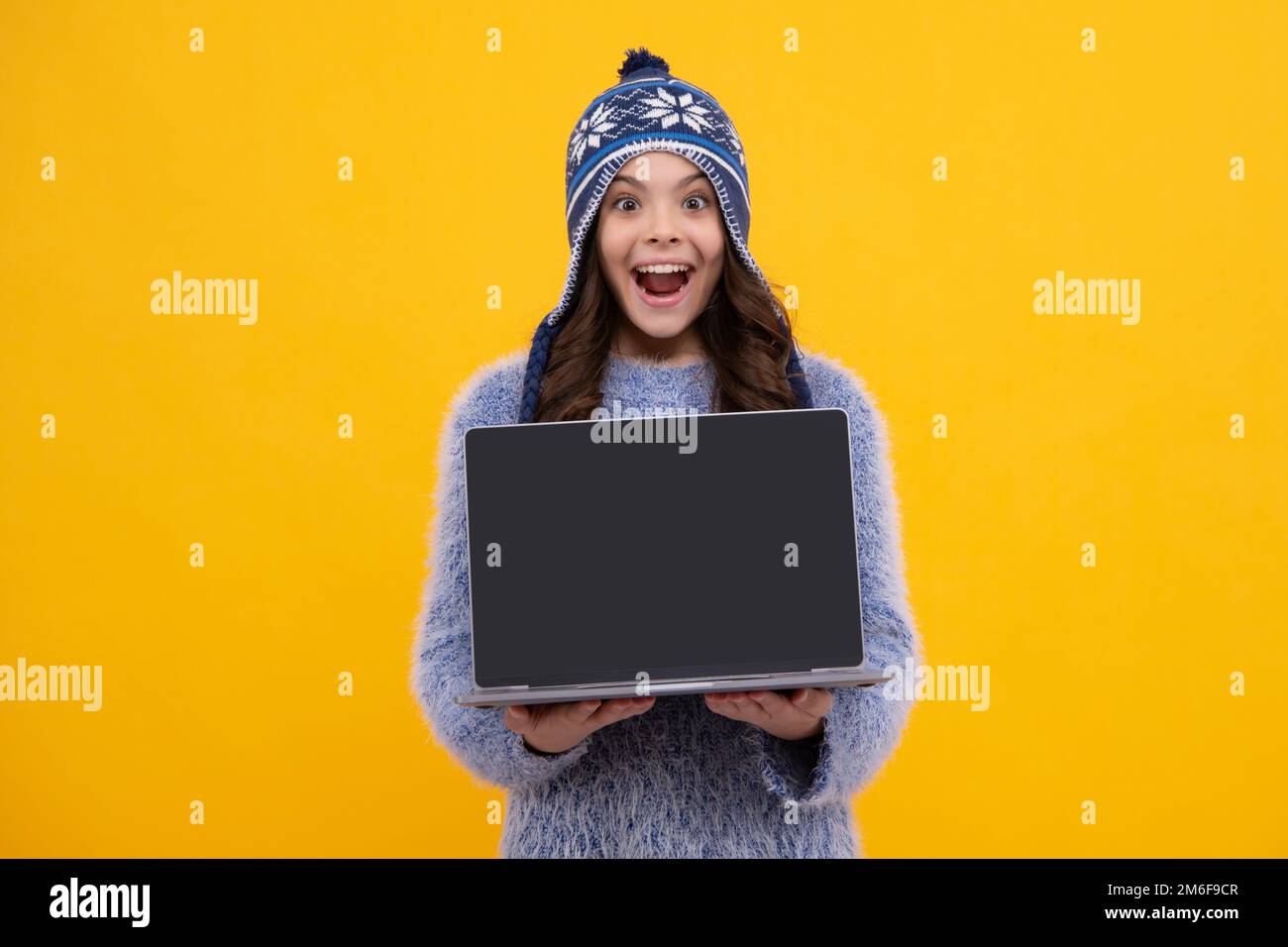 Winter school. Teenager school girl hold laptop in autumn clothes on ...