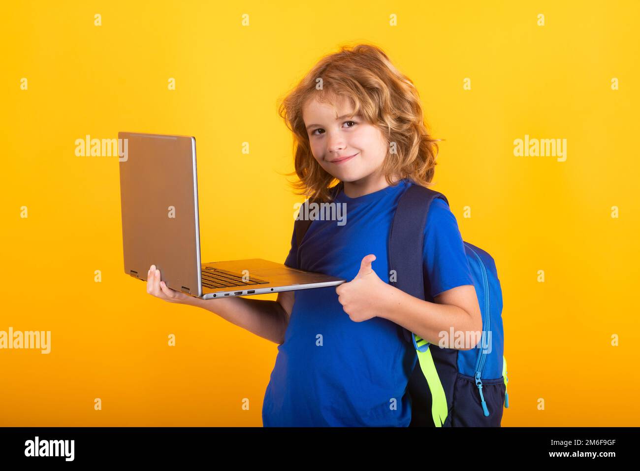 School child using laptop computer. School and kids. Cute blonde child ...