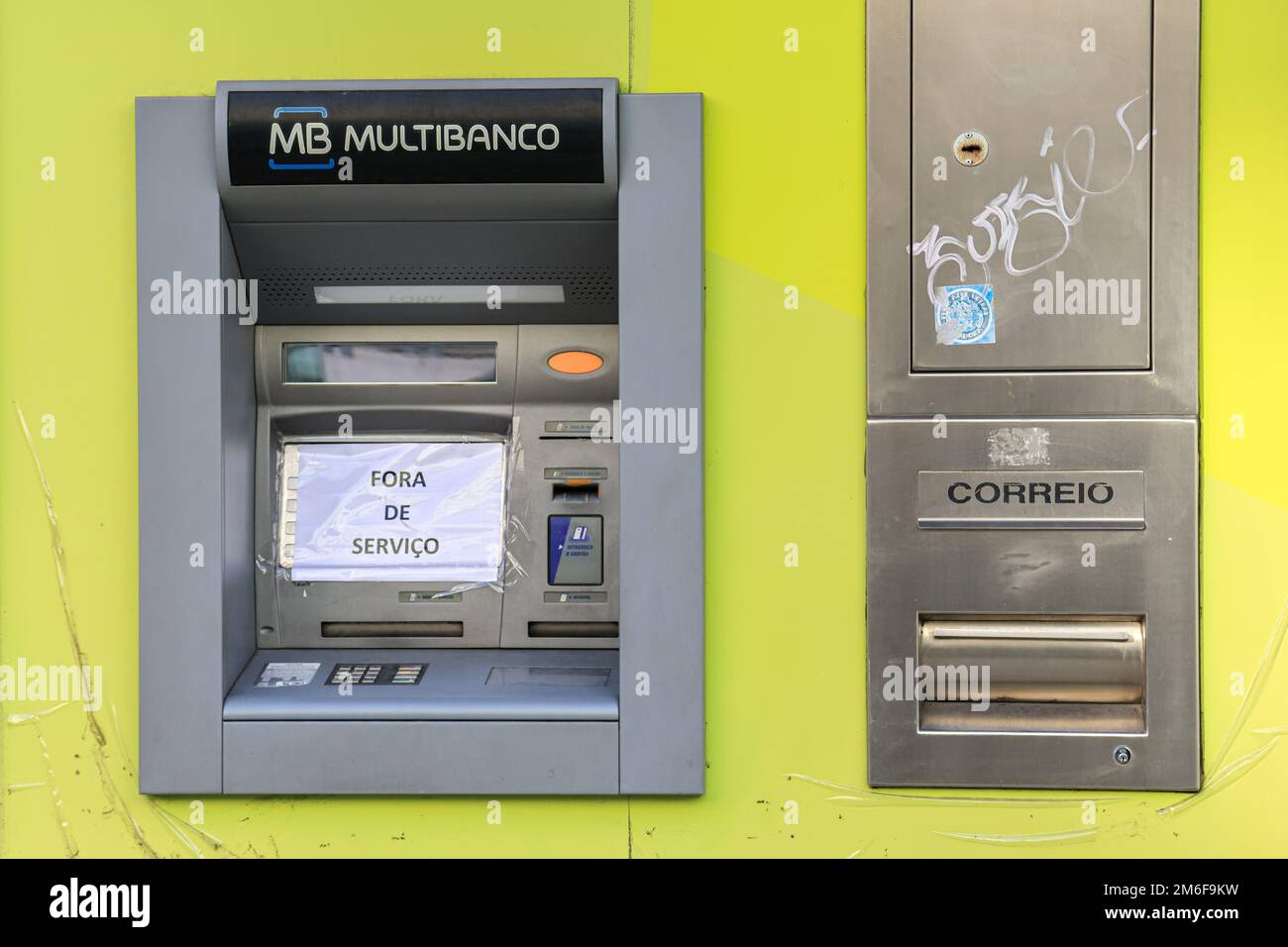 An ATM machine on the street with an out of service notice in Lisbon ...