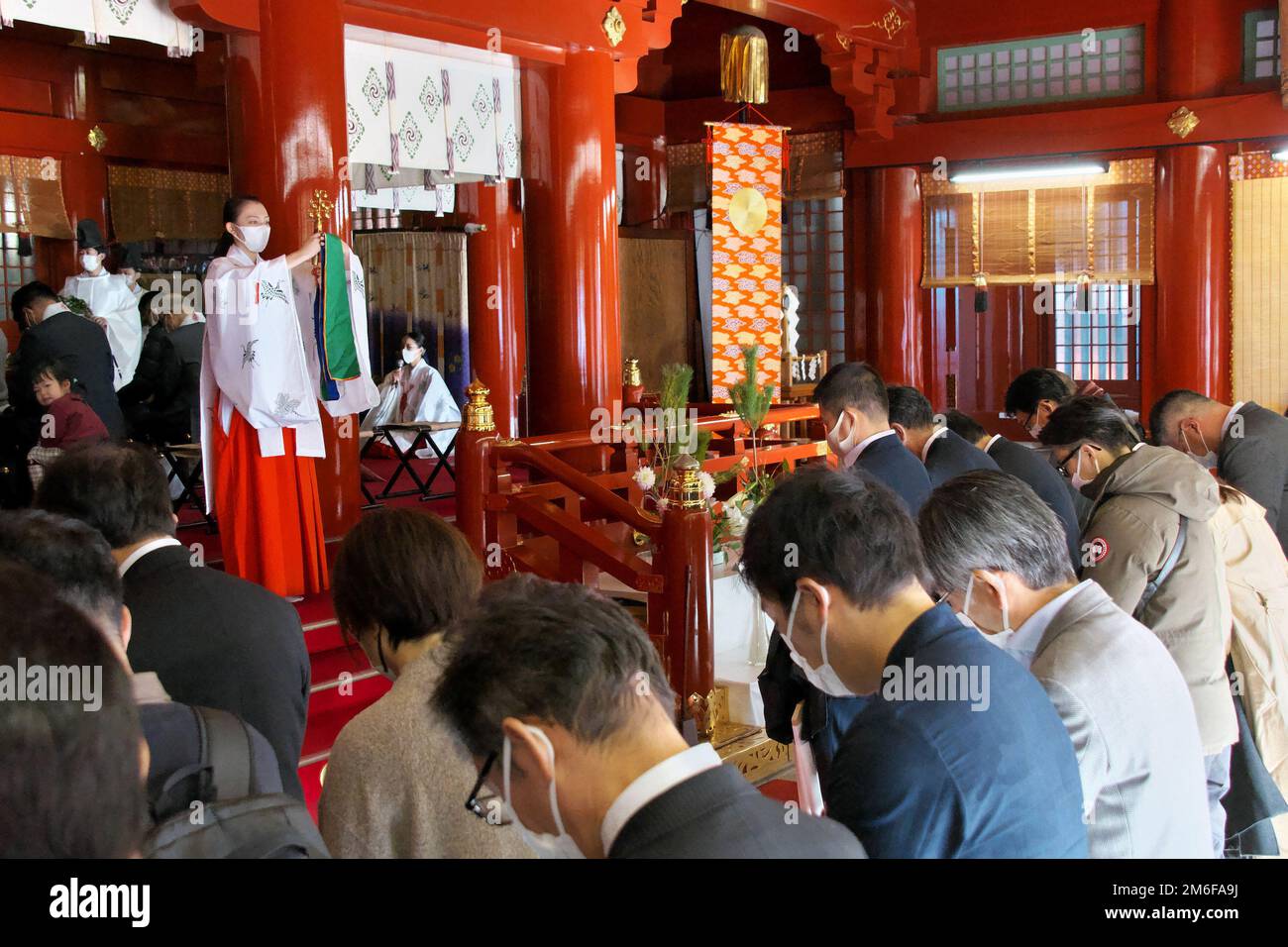 Tokyo, Japan. 04th Jan, 2023. Shrine maiden pray for worshipper during ...
