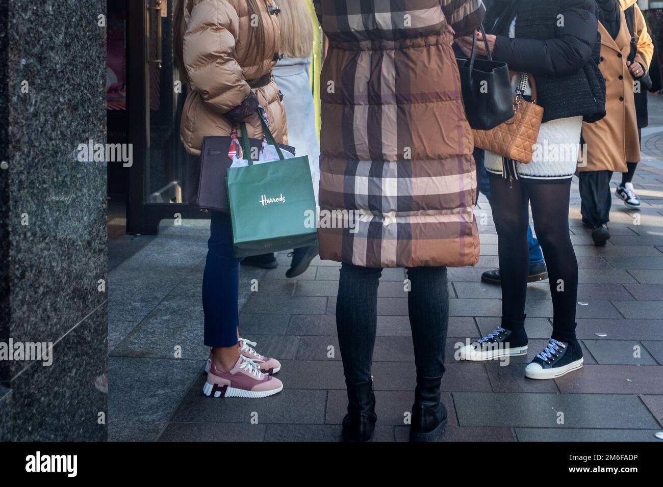 London- December 2022: Shoppers outside Harrods in Knightsbridge Stock ...