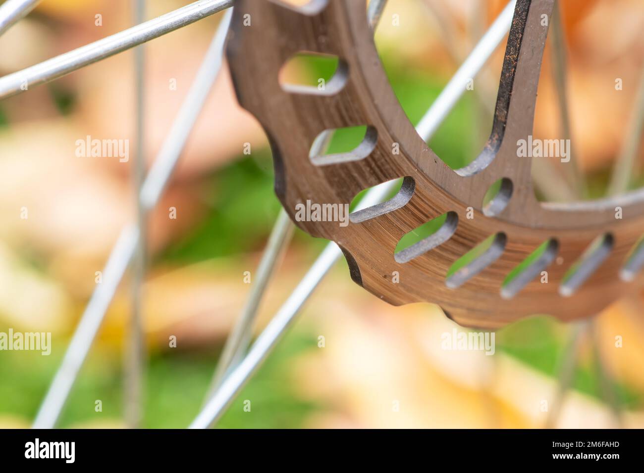 Bicycle disk brakes close up, grey metal disc attached to bike wheel ...