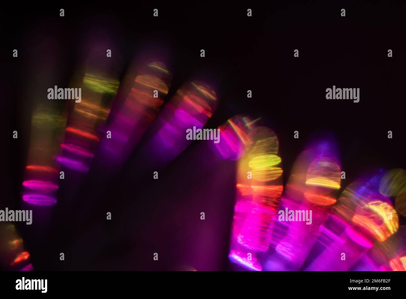 Abstract blurred colorful lens flare bokeh on black Stock Photo - Alamy