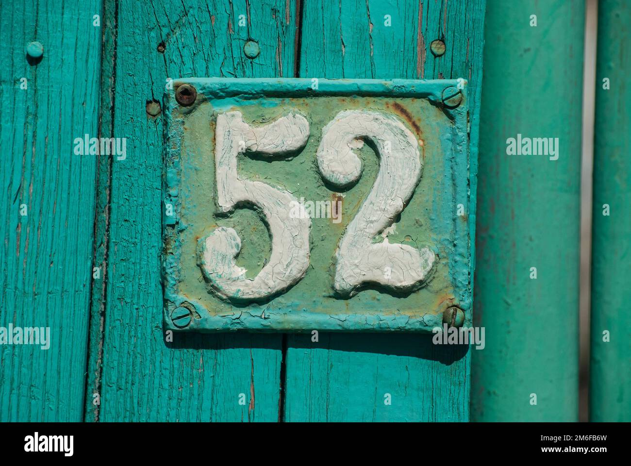 Old retro weathered cast iron plate with number 52 closeup Stock Photo ...