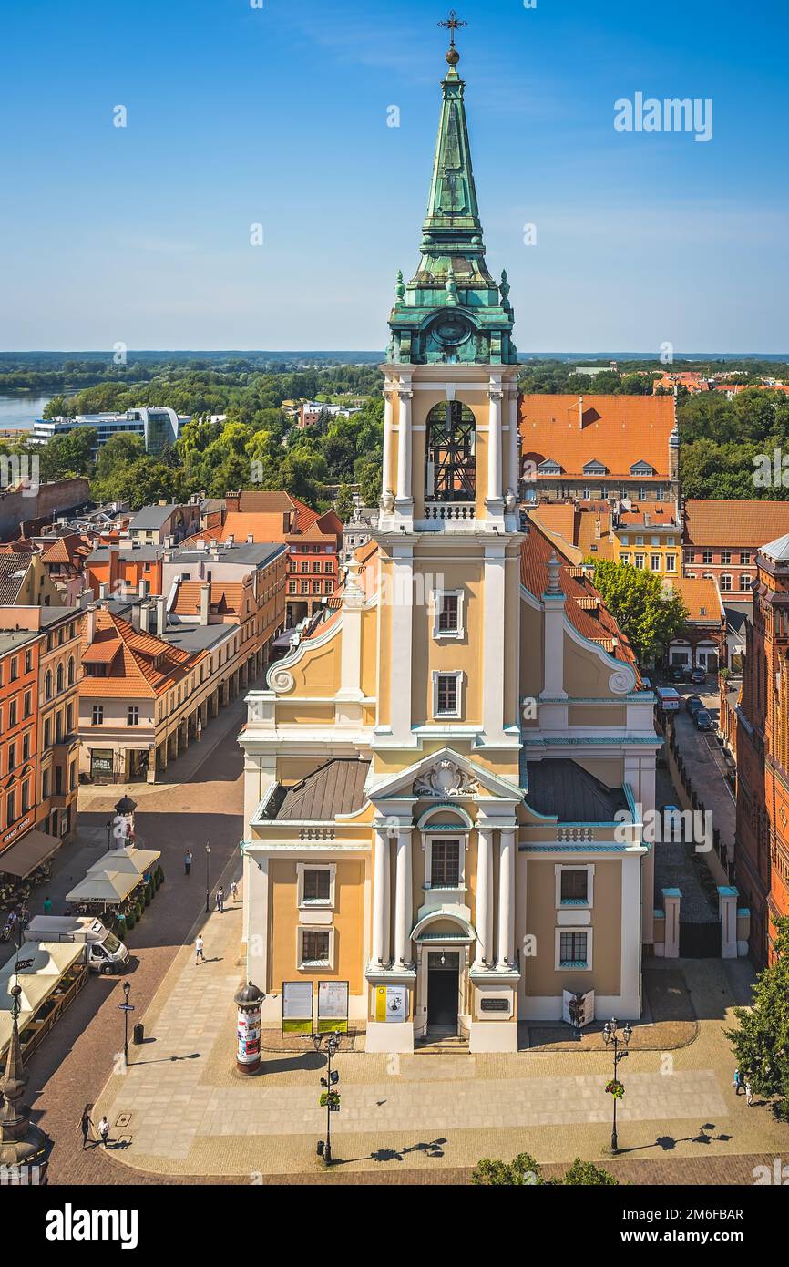 Church of the Holy Spirit surrounded by buildings in Torun Stock Photo ...