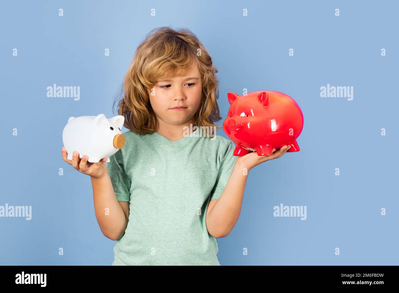 Piggy bank for money. Kid putting coin into piggy bank for saving with ...