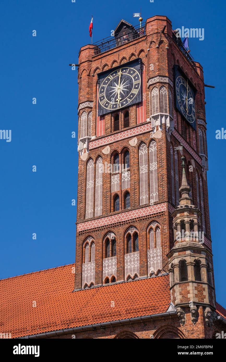 Low angle shot of the Clock Tower of Ratusz building in Torun, Poland ...