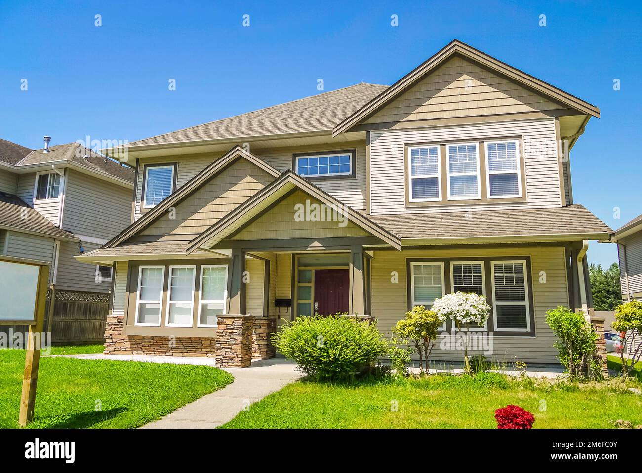 Family house with concrete pathway over the front yard Stock Photo - Alamy
