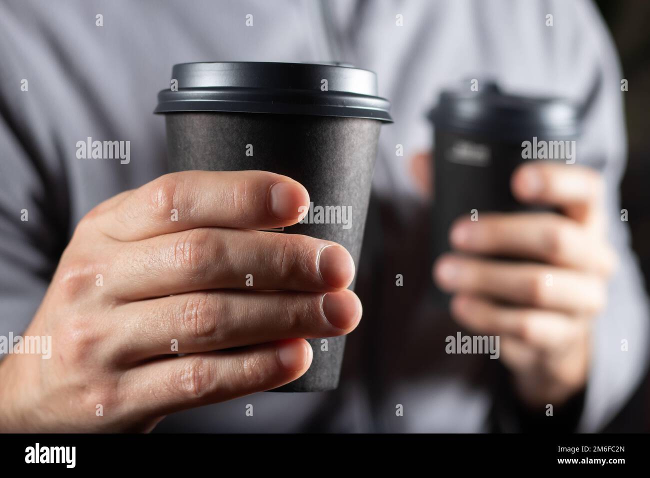 Man carrying takeaway cup hi-res stock photography and images - Alamy