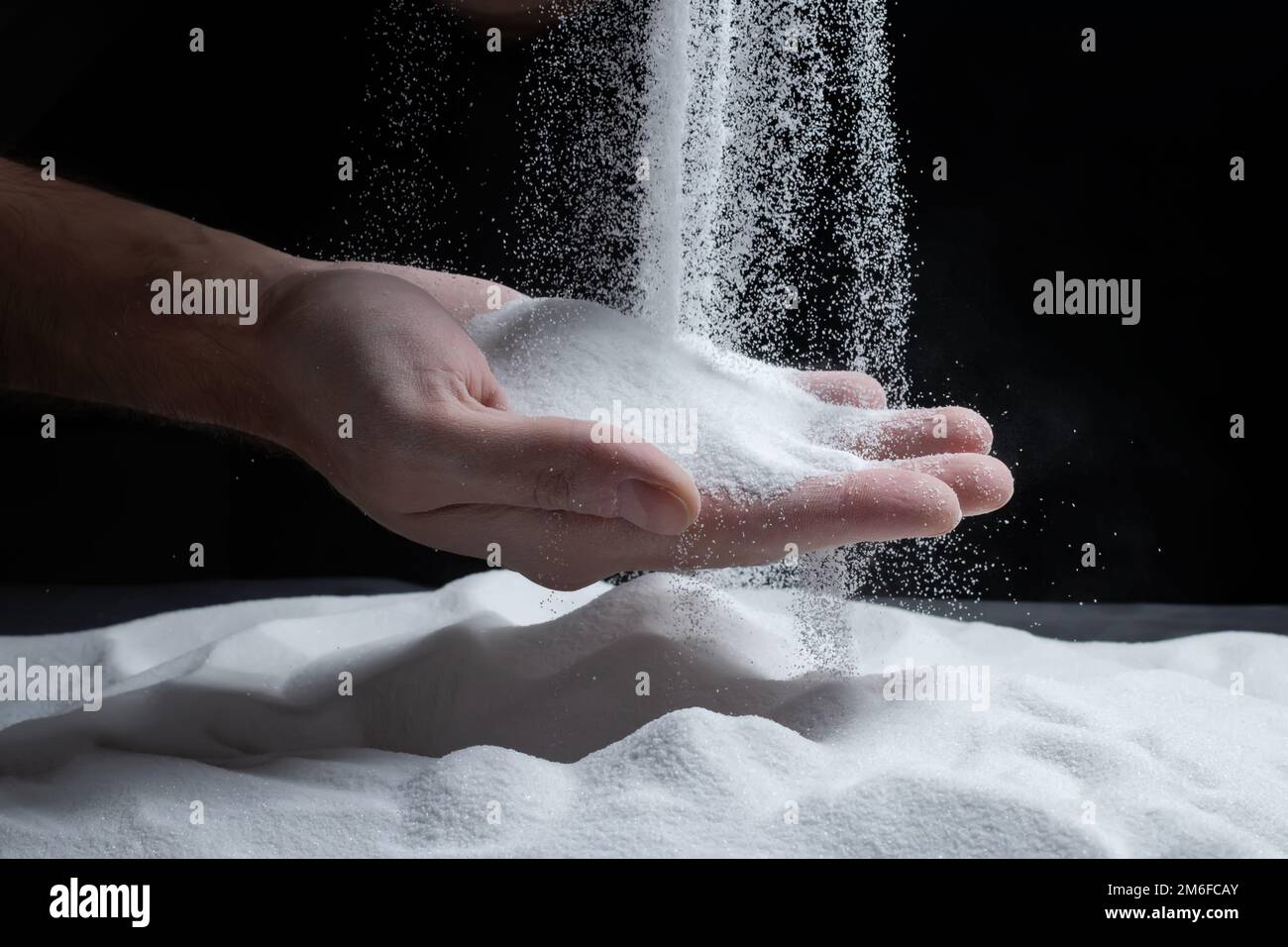sand running through hands as a symbol for time running Stock Photo - Alamy