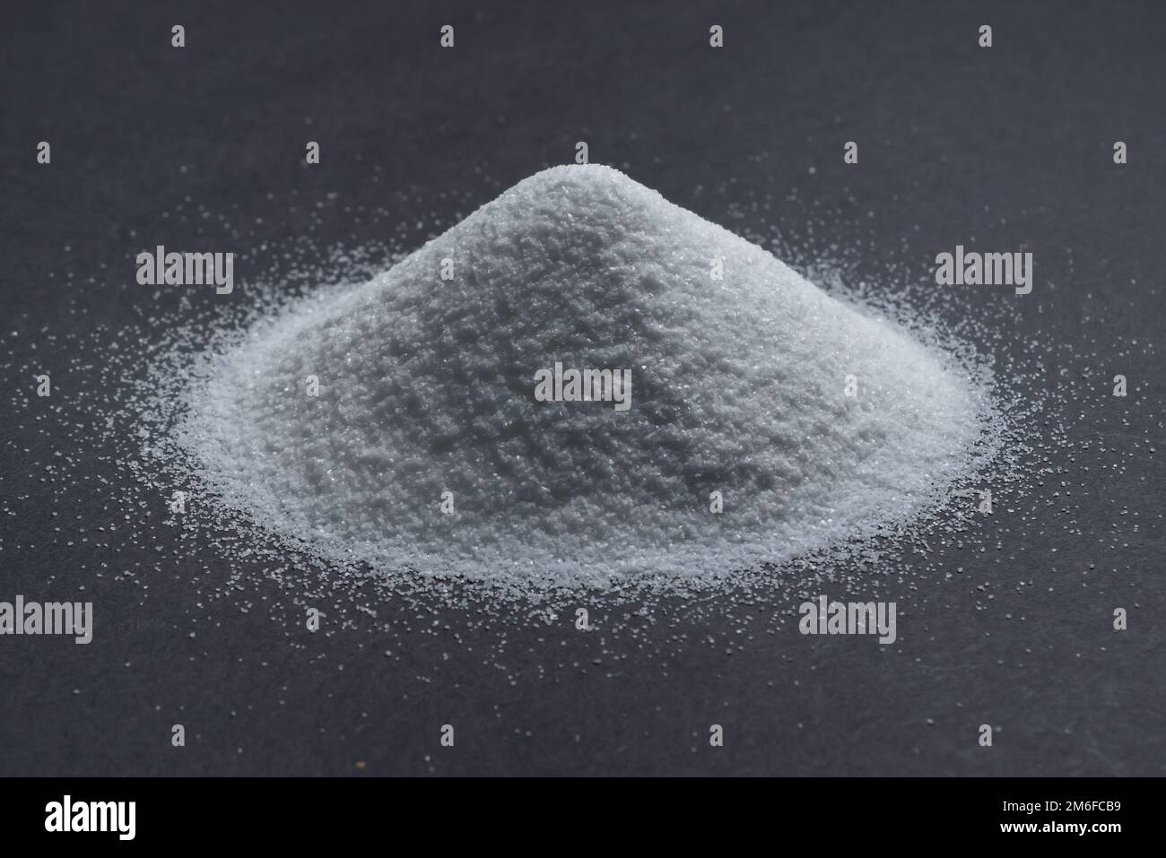 White quartz sand on a gray background in the form of a slide. quartz ...
