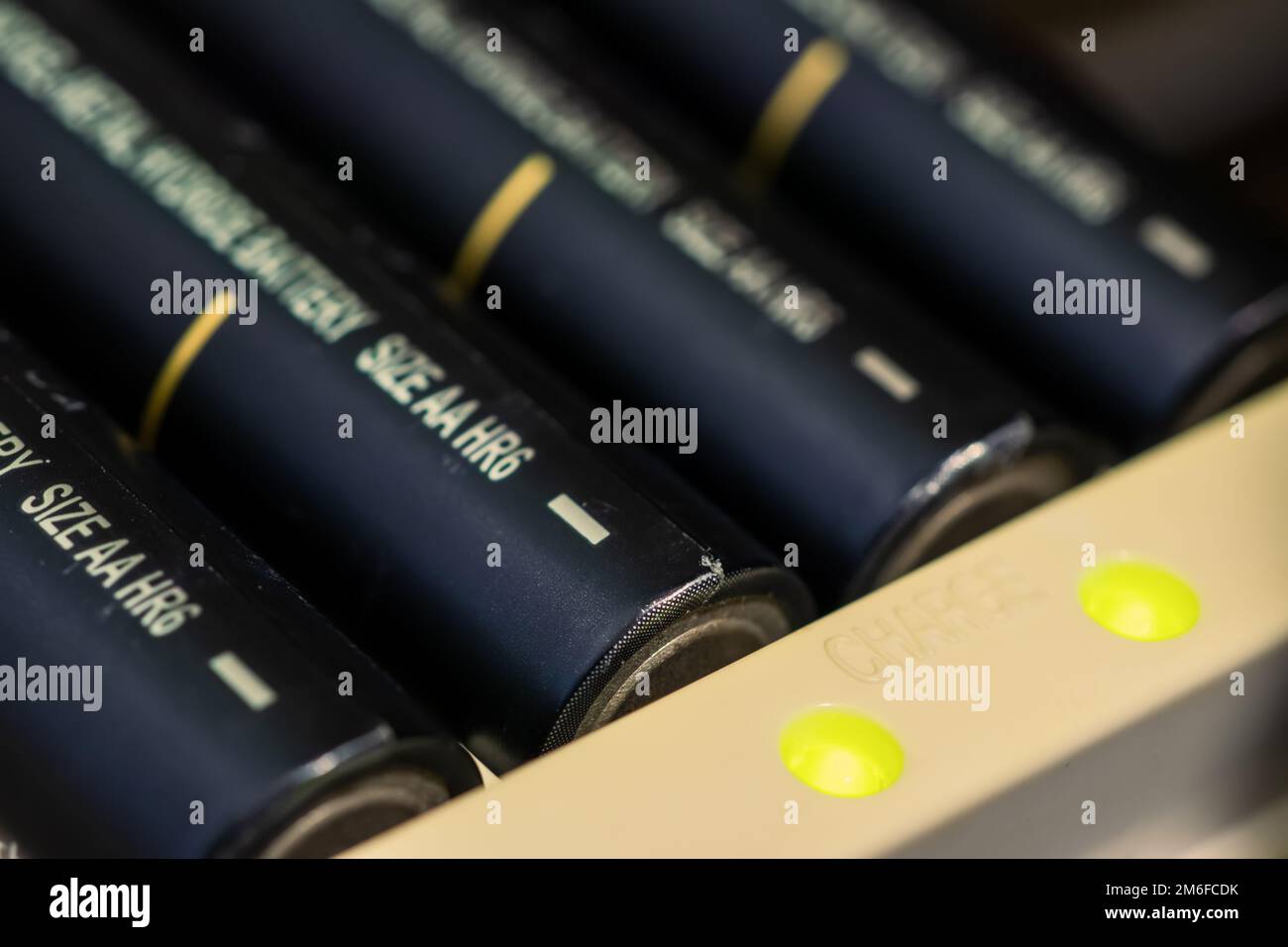 finger batteries AA are charged in the charger Stock Photo - Alamy