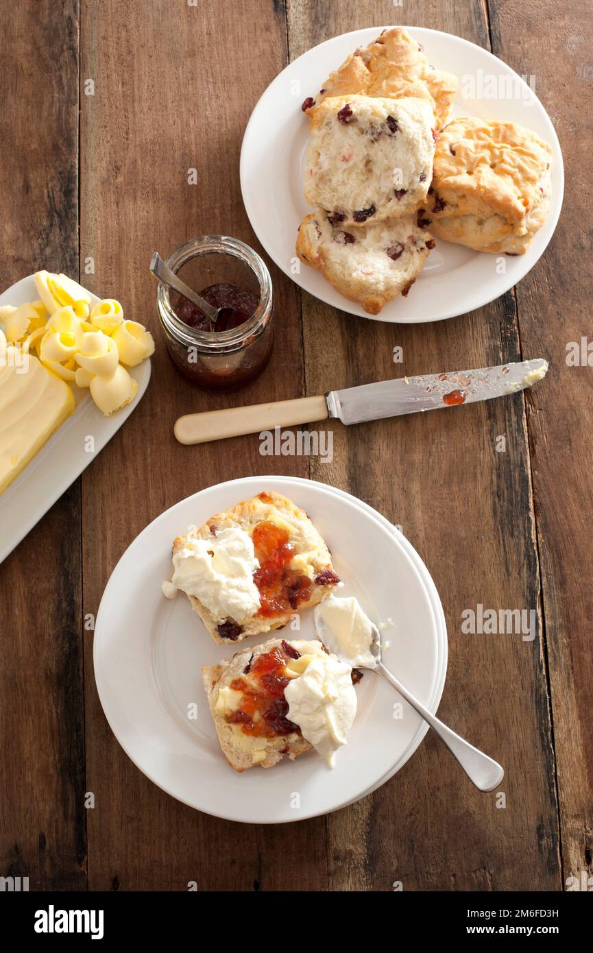 Rock cakes or raisin buns with jam and cream Stock Photo - Alamy