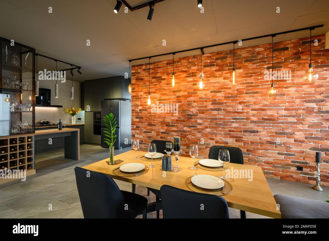Modern luxurious dark gray and kitchen with dining table Stock Photo ...