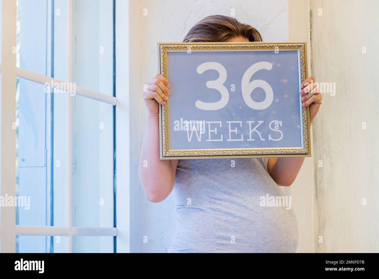 36 weeks of pregnancy sign in woman hands Stock Photo - Alamy