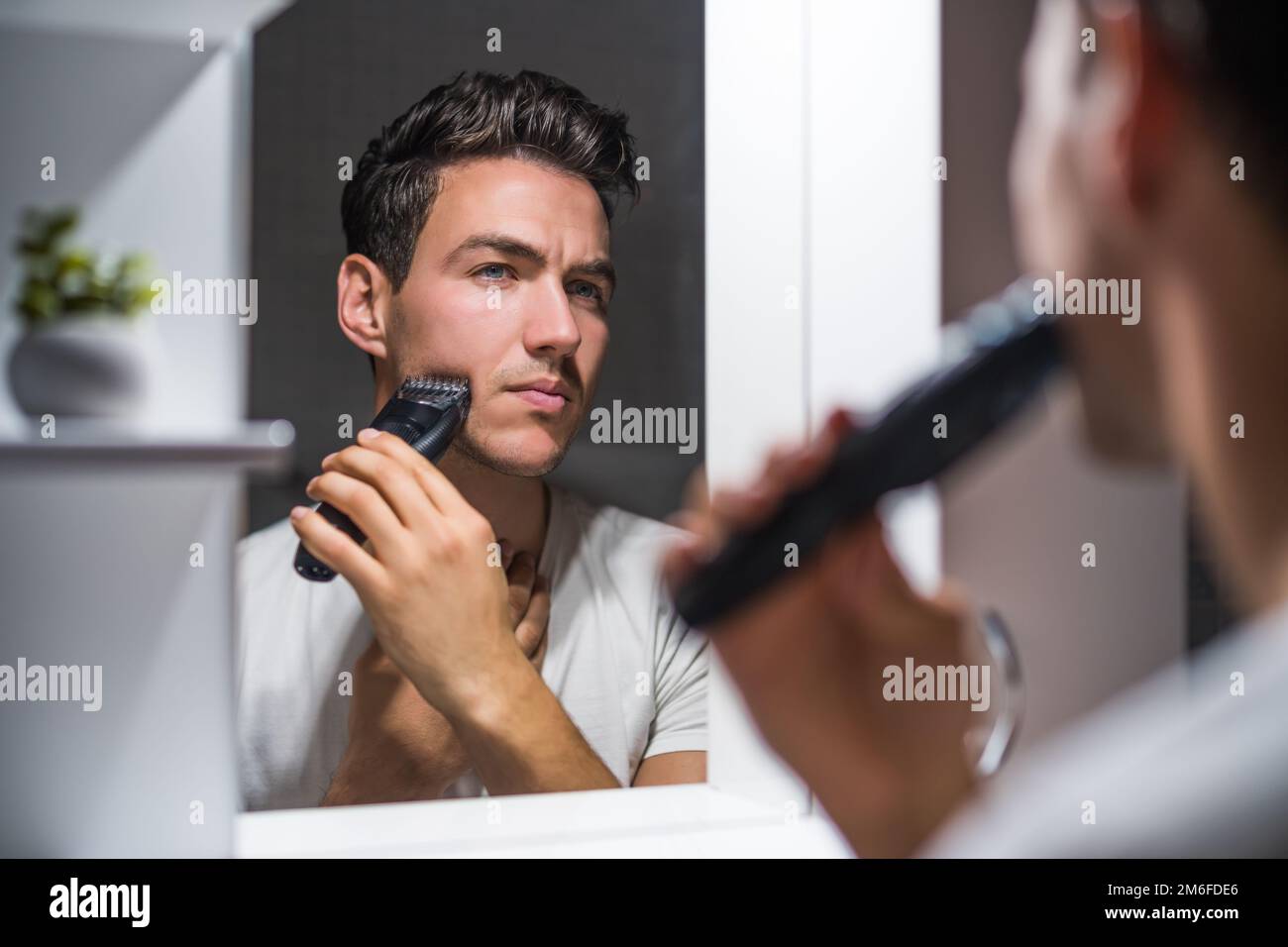 Young man shaving himself close hi-res stock photography and images - Alamy