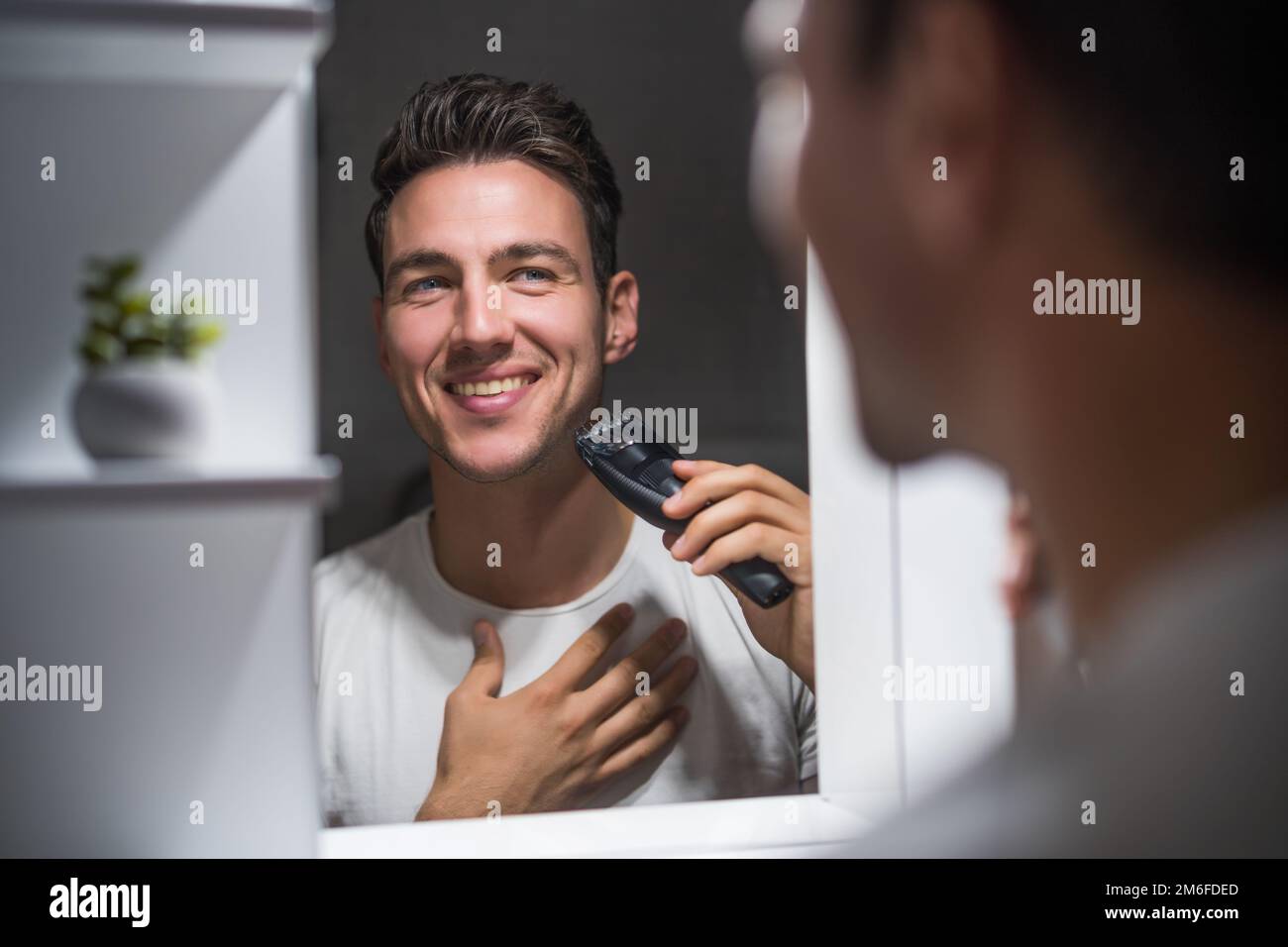 Young man shaving himself close hi-res stock photography and images - Alamy
