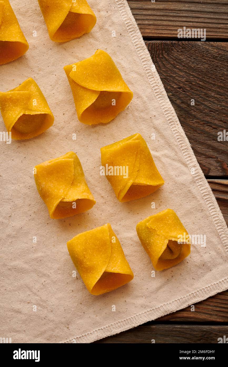 Raw homemade ravioli pasta with spinach and ricotta Stock Photo - Alamy