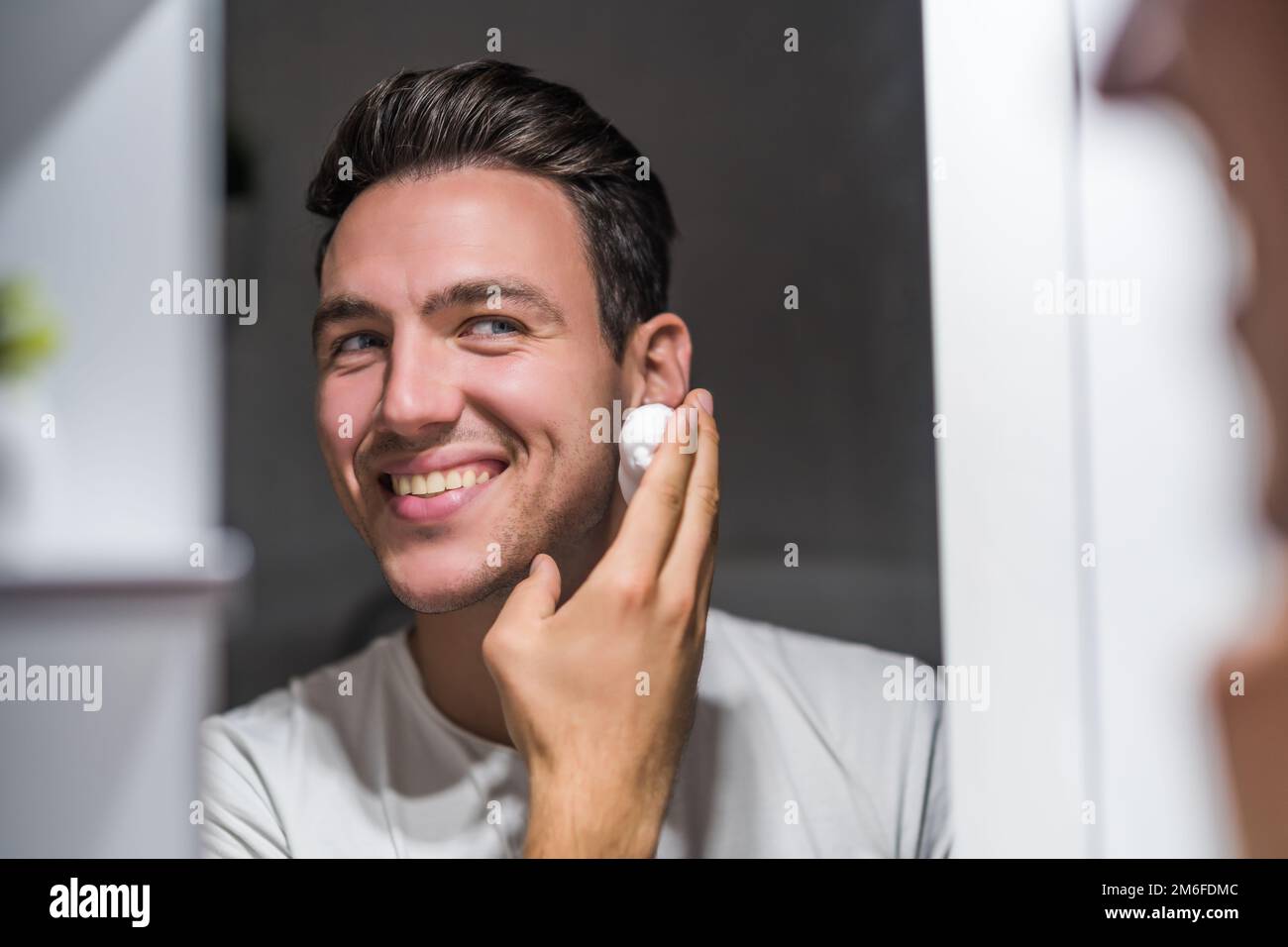 Young man shaving himself close hi-res stock photography and images - Alamy