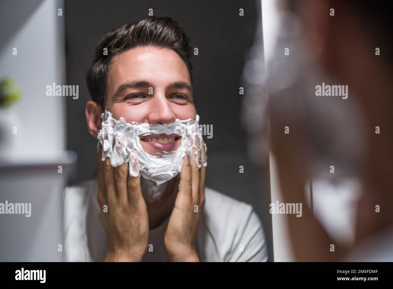 Young man shaving himself close hi-res stock photography and images - Alamy